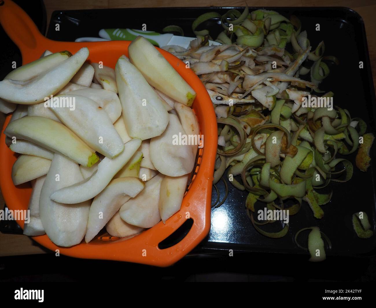 pear preservation process. Peels of pear placed on a metal try with an ...