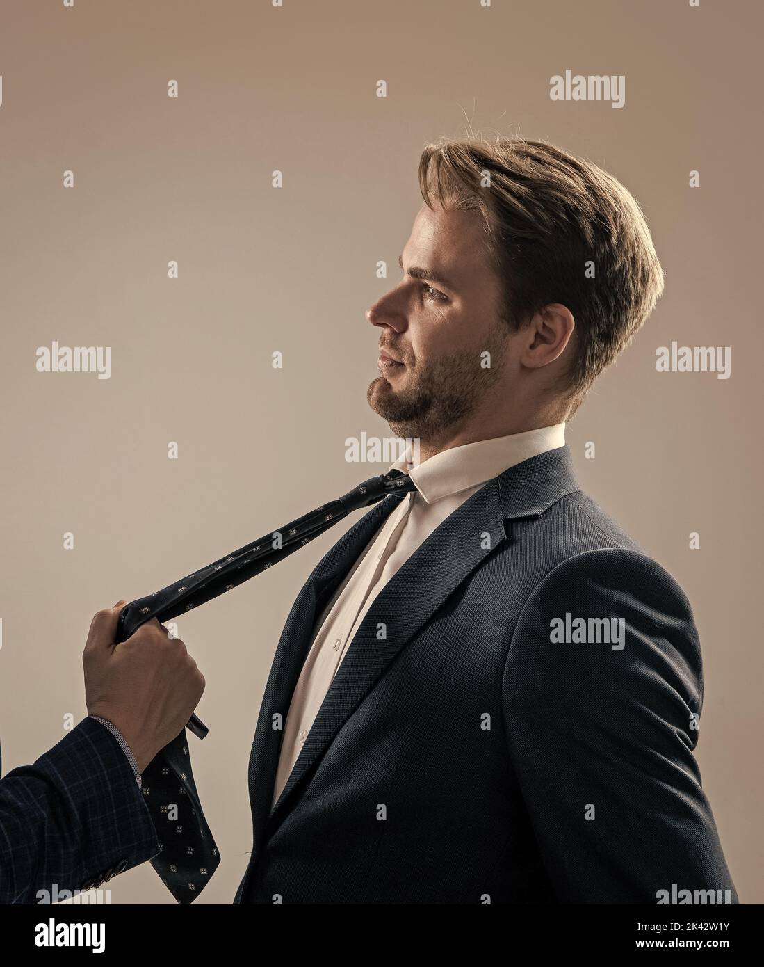 Professional employee man being pulled by necktie during workplace ...