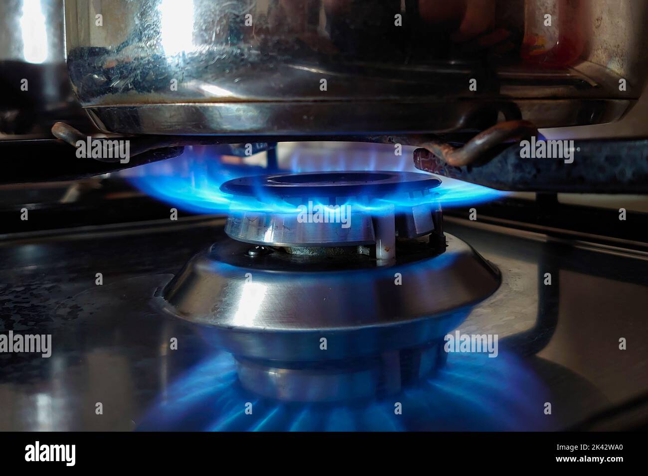 Gas cooker close-up with flame Stock Photo - Alamy