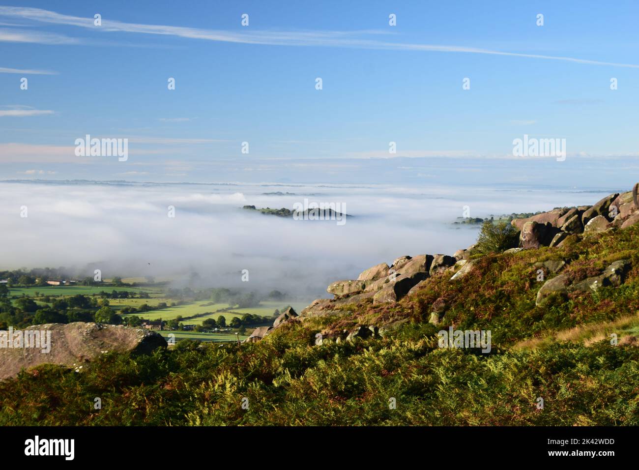 Blue sky and sunlight bathed the Roaches rocks and surrounding ...