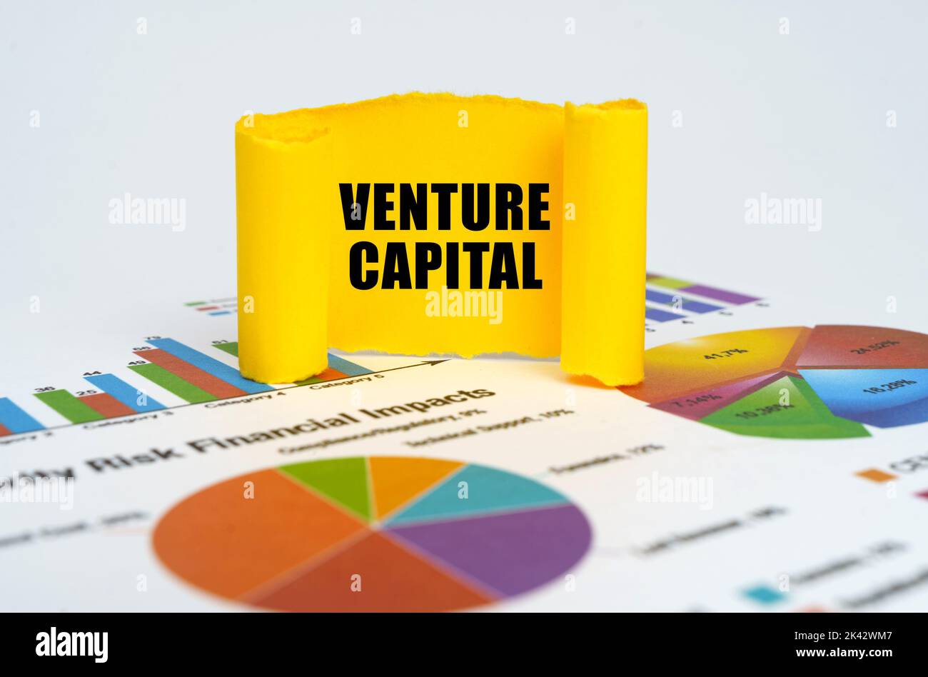 Business concept. Against the background of graphs and charts, a yellow ...