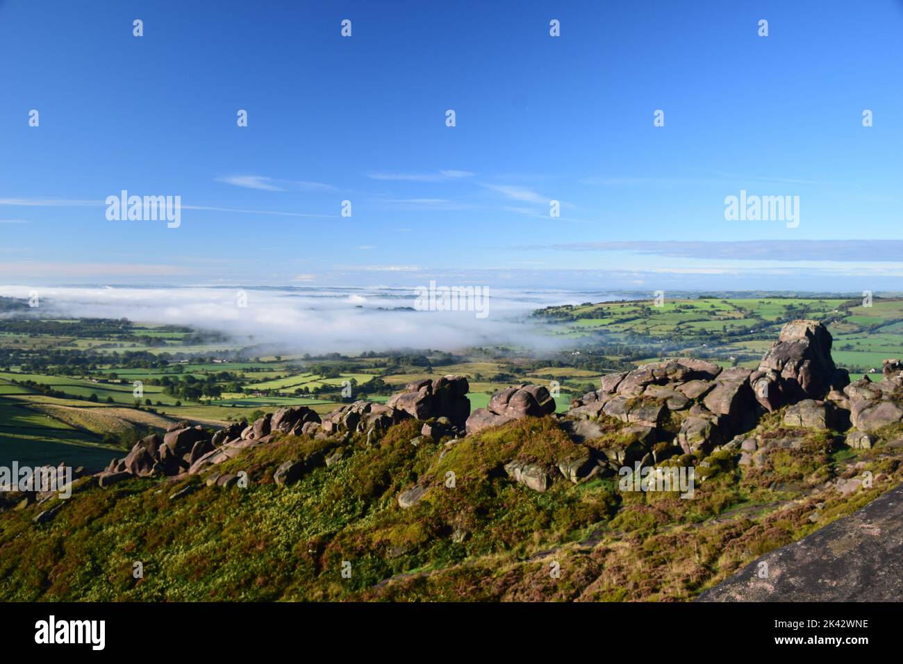 Blue sky and sunlight bathed the Roaches rocks and surrounding ...