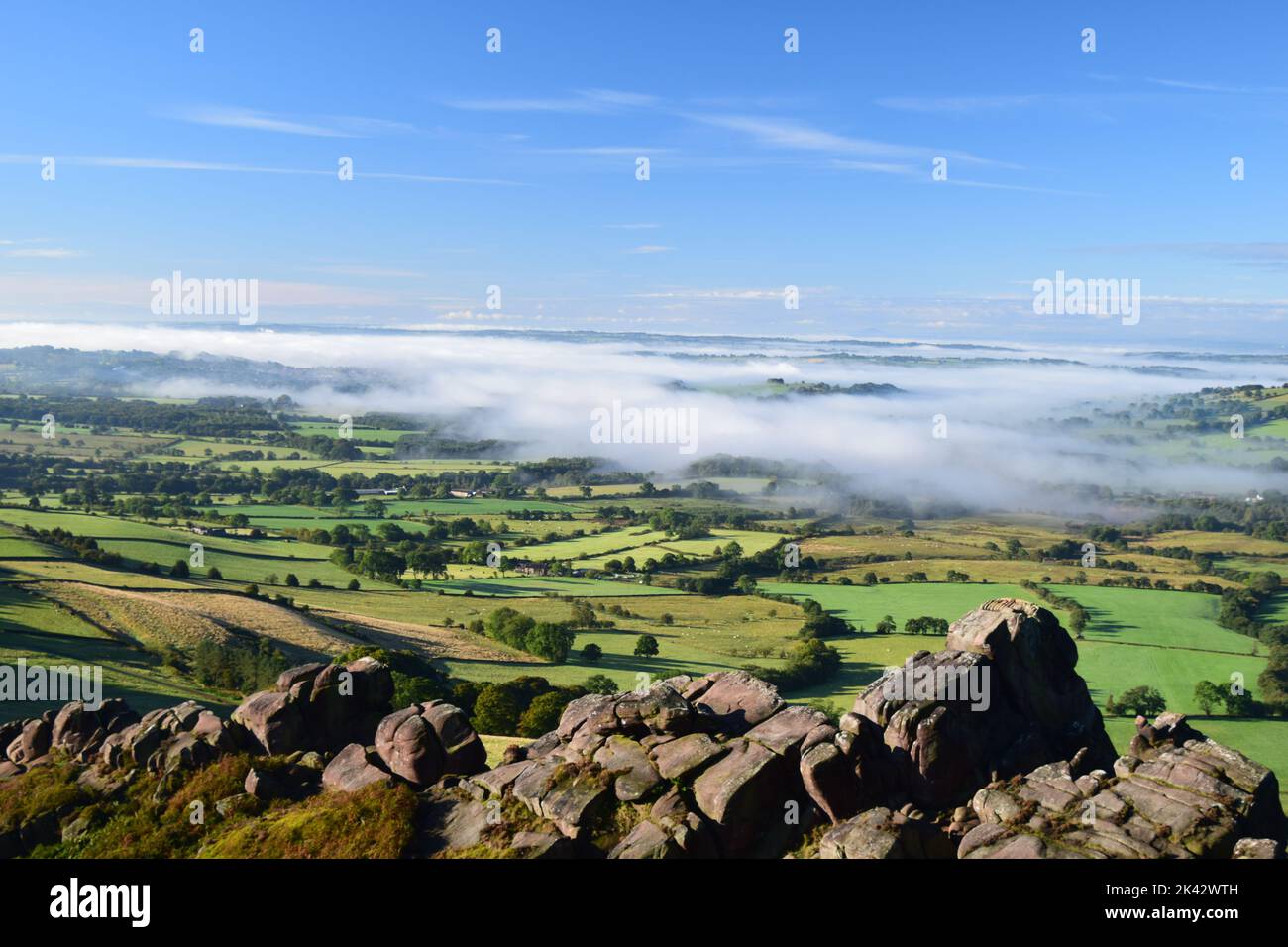 Blue sky and sunlight bathed the Roaches rocks and surrounding ...