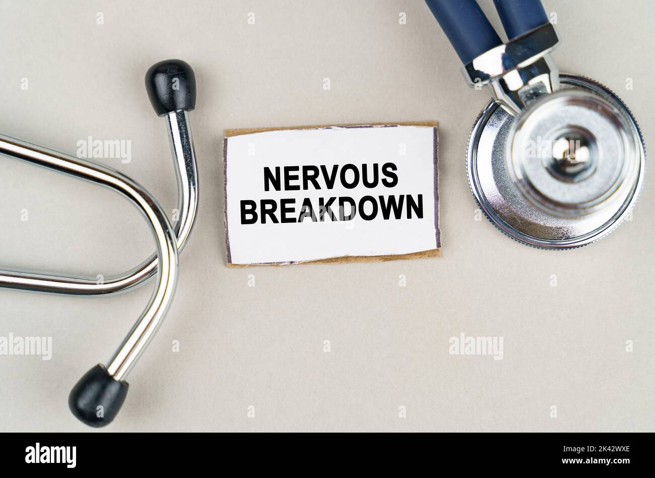 Medical concept. On a gray background, a stethoscope and a cardboard ...