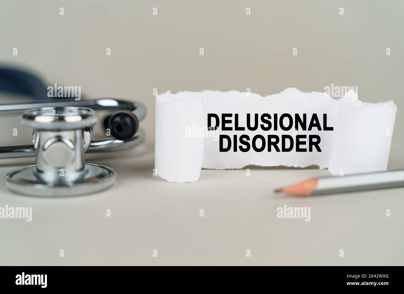 Medical concept. On a gray background, a stethoscope, a pencil and a ...