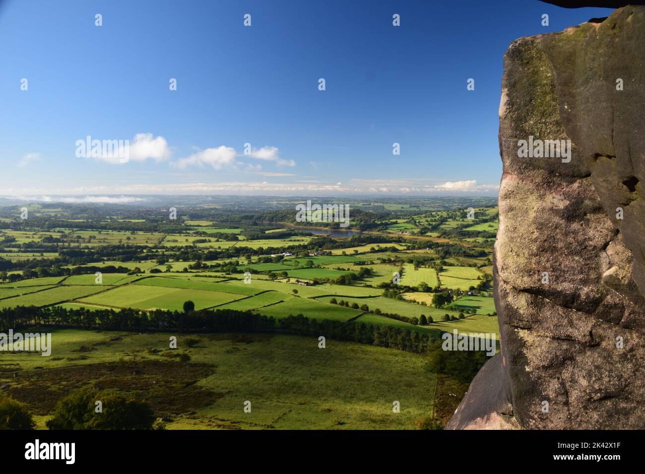 Blue sky and sunlight bathed the Roaches rocks and surrounding ...