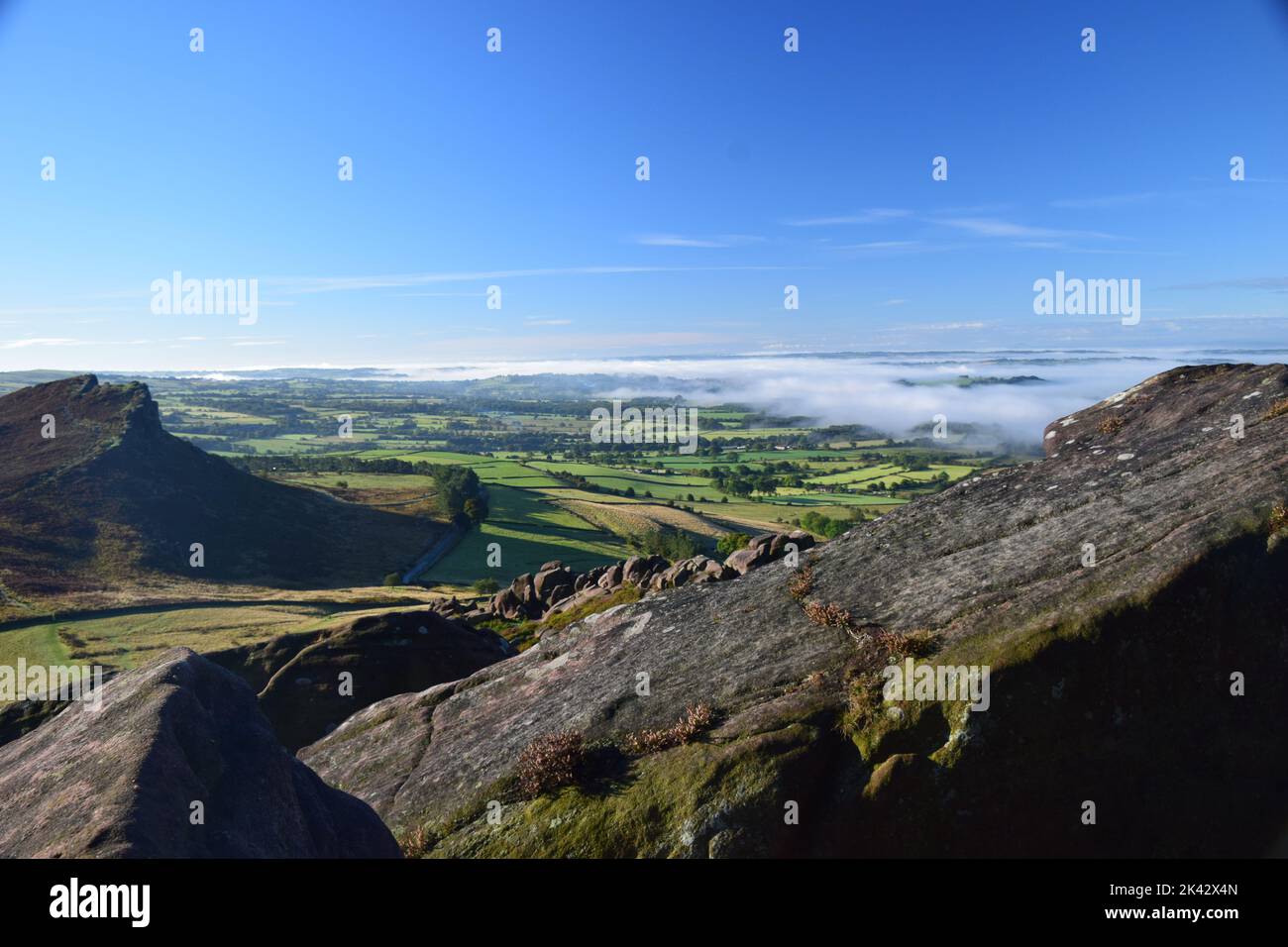 Blue sky and sunlight bathed the Roaches rocks and surrounding ...