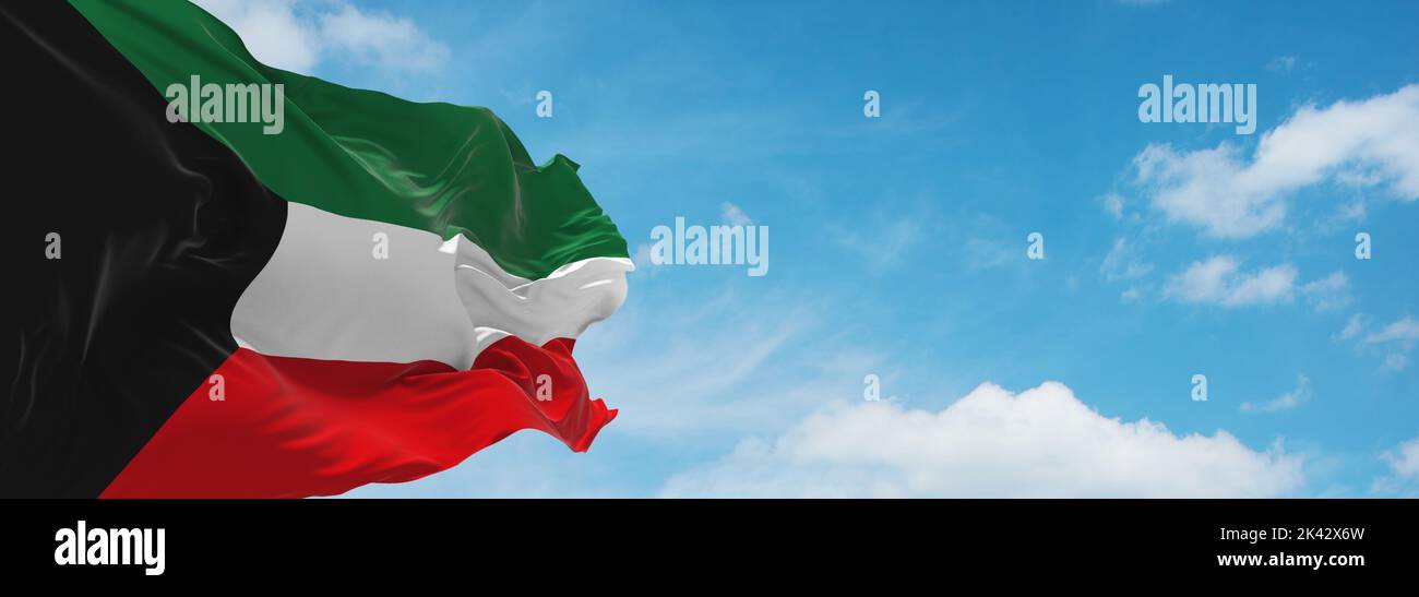 flag of Arab peoples Kuwaitis at cloudy sky background, panoramic view ...