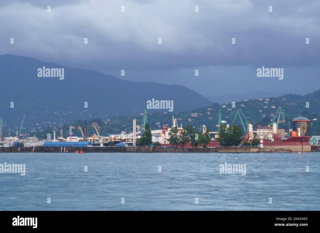 View of the sea, coast and cargo port Stock Photo - Alamy