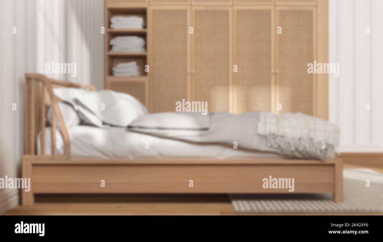 Blurred background, scandinavian wooden bedroom, double bed with ...