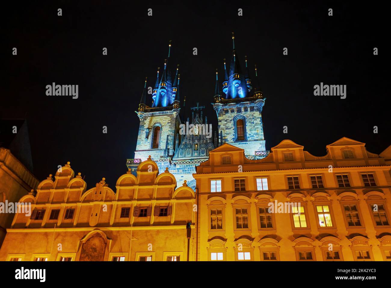 The bright illuminated bell towers of Tyn Churh, standing before ...