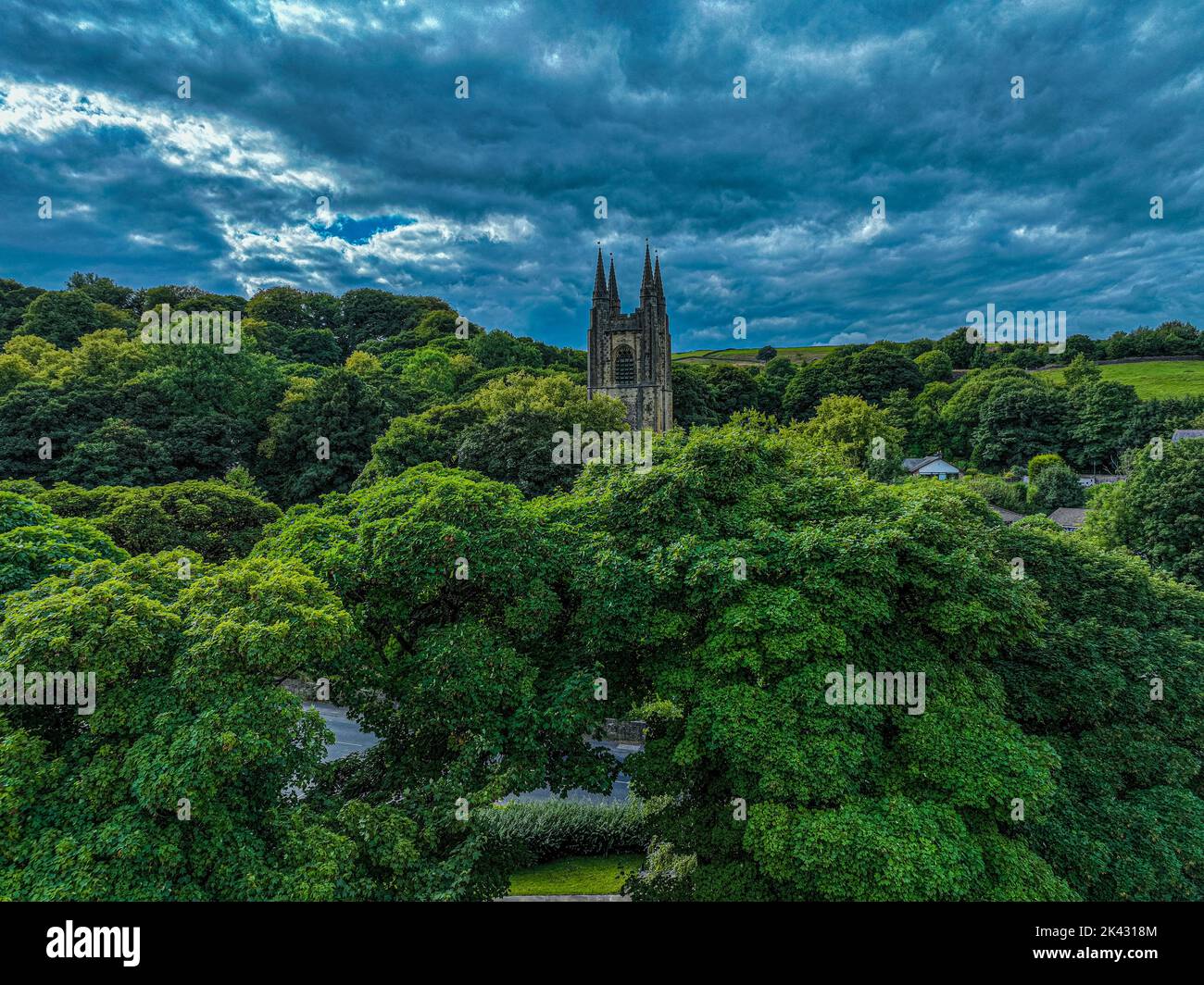 Aerial photograph of St John the Evangelist Church steeple rising above ...
