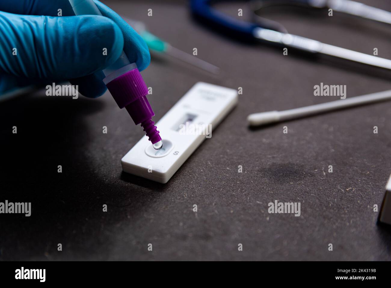 In this photo illustration, a rapid antigen test for SARS-CoV-2 seen ...
