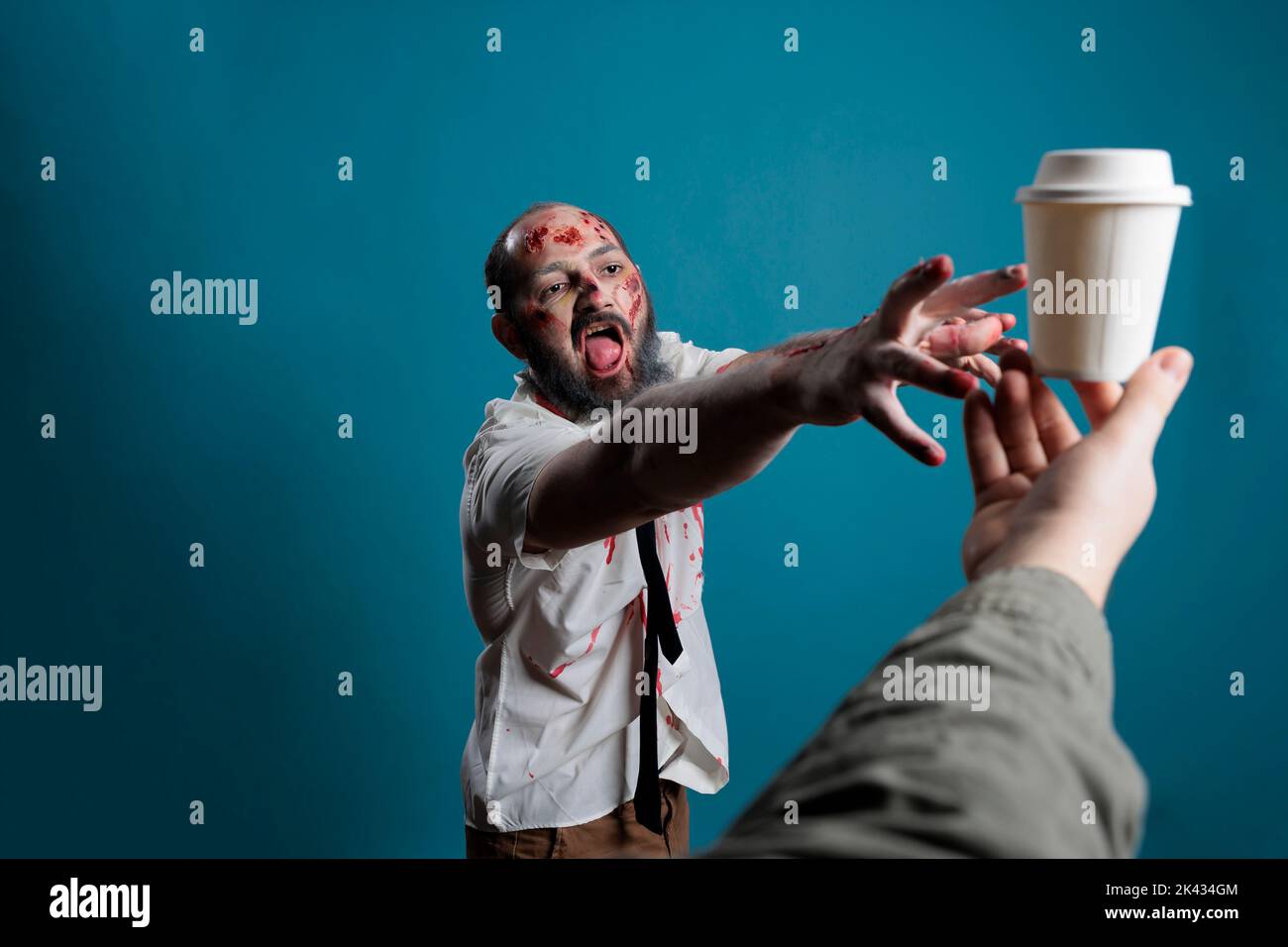 Spooky horror monster wanting cup of coffee, chasing after hand with ...
