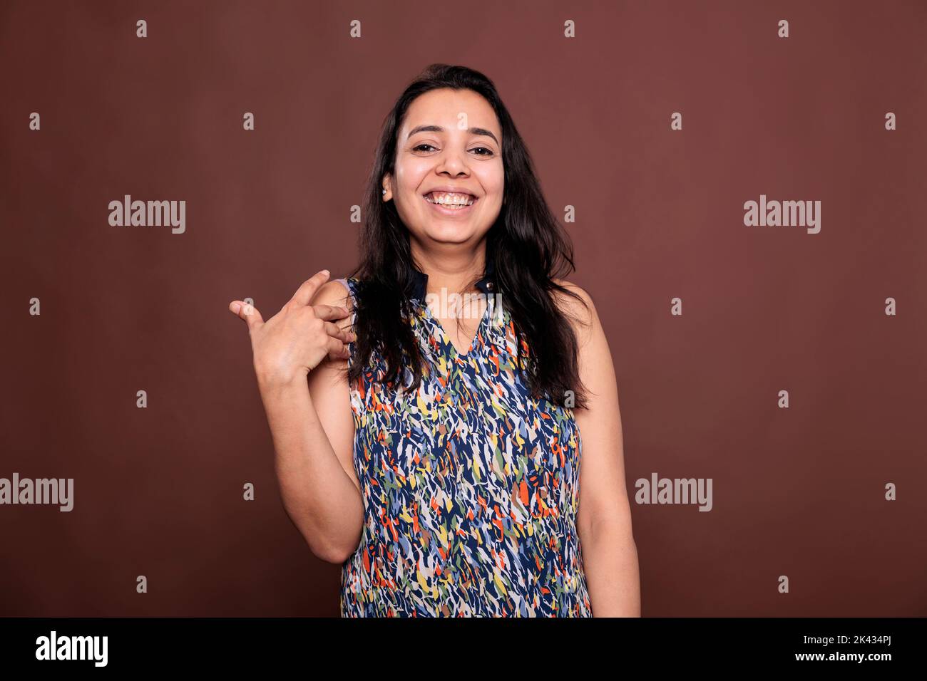 Smiling indian woman laughing, pointing at herself with hand portrait ...