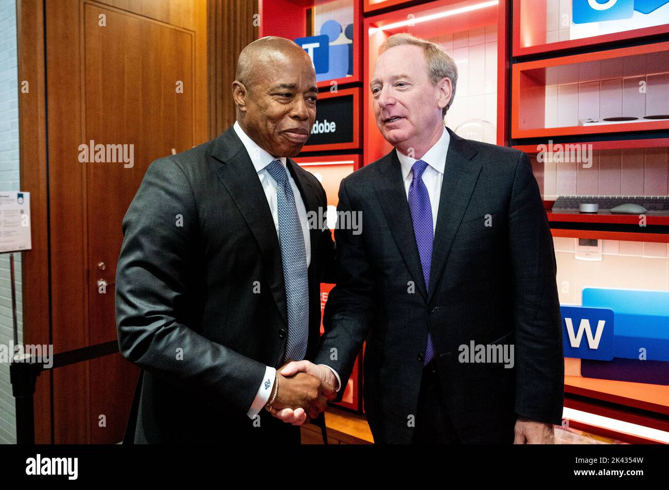 New York City Mayor Eric Adams (D) shaking hands with Microsoft ...