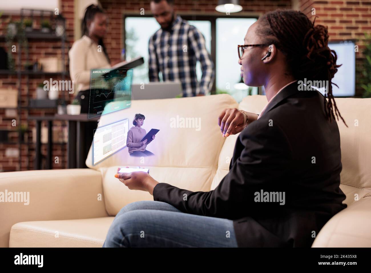 Female employee talking to ai hologram, using artificial intelligence ...