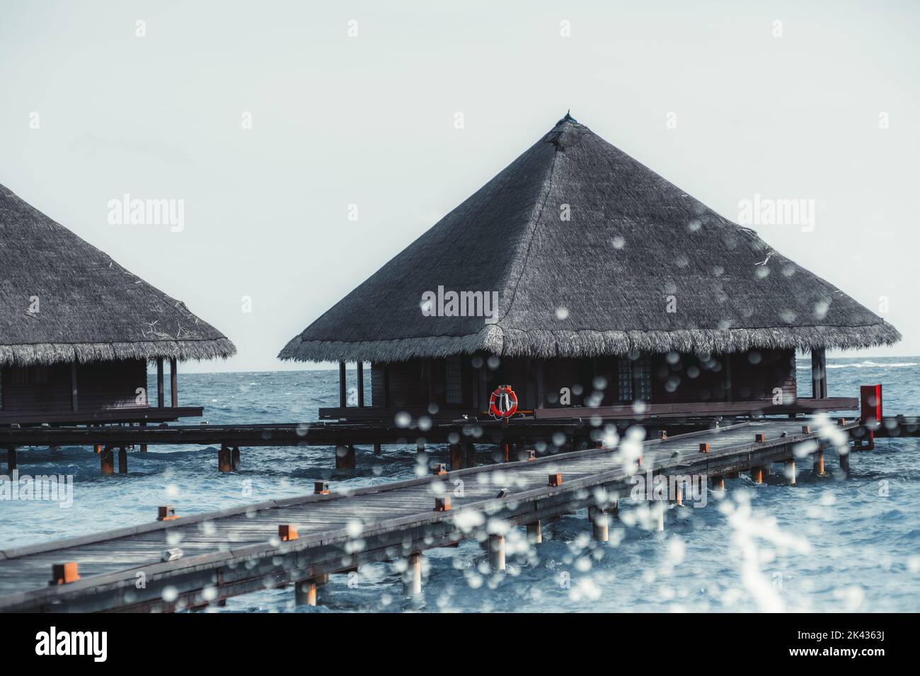 View of typical luxury triangle cottage houses on a Maldives resort ...