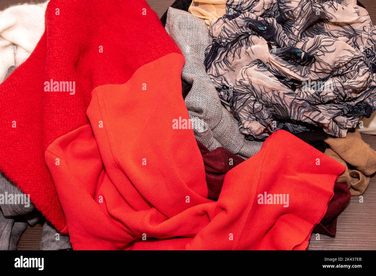 Messy pile of worn textile fashion wardrobe Stock Photo - Alamy