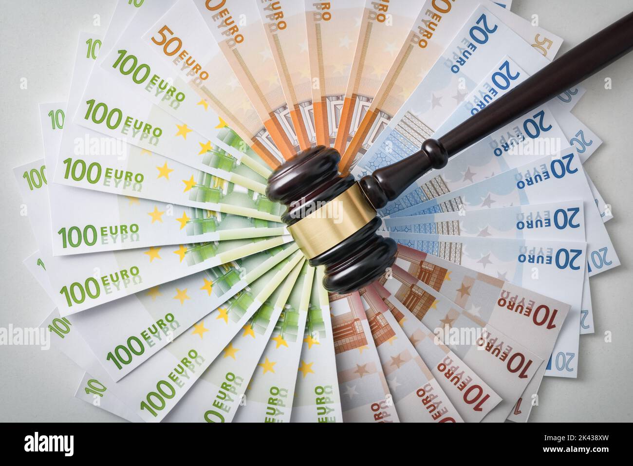 Concept of financial judgment with judge's gavel on a pile of banknotes ...