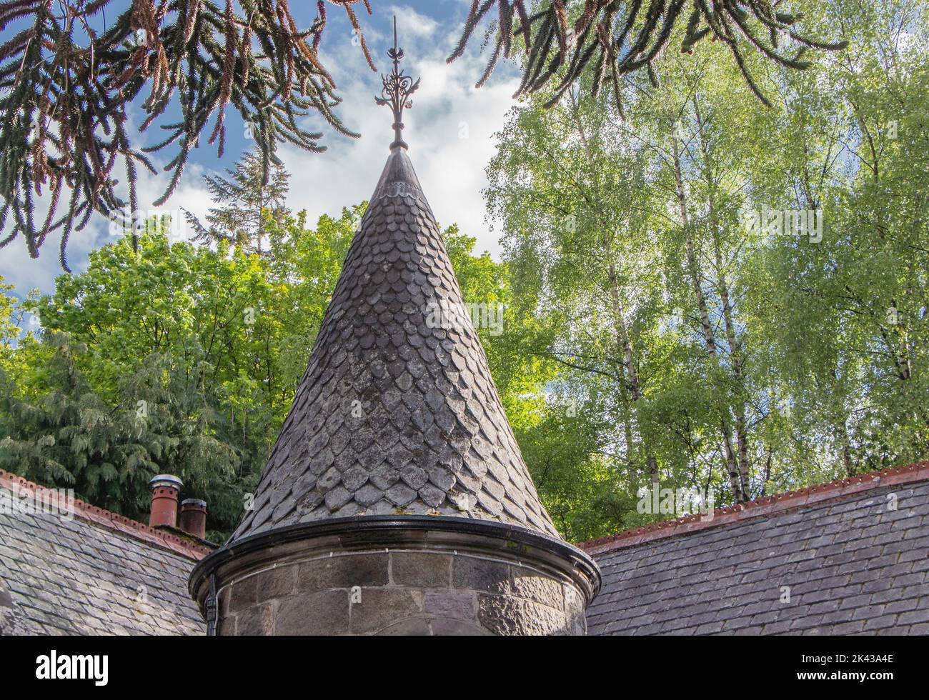 grey slate turret against blue sky with onate fancy finial Stock Photo ...