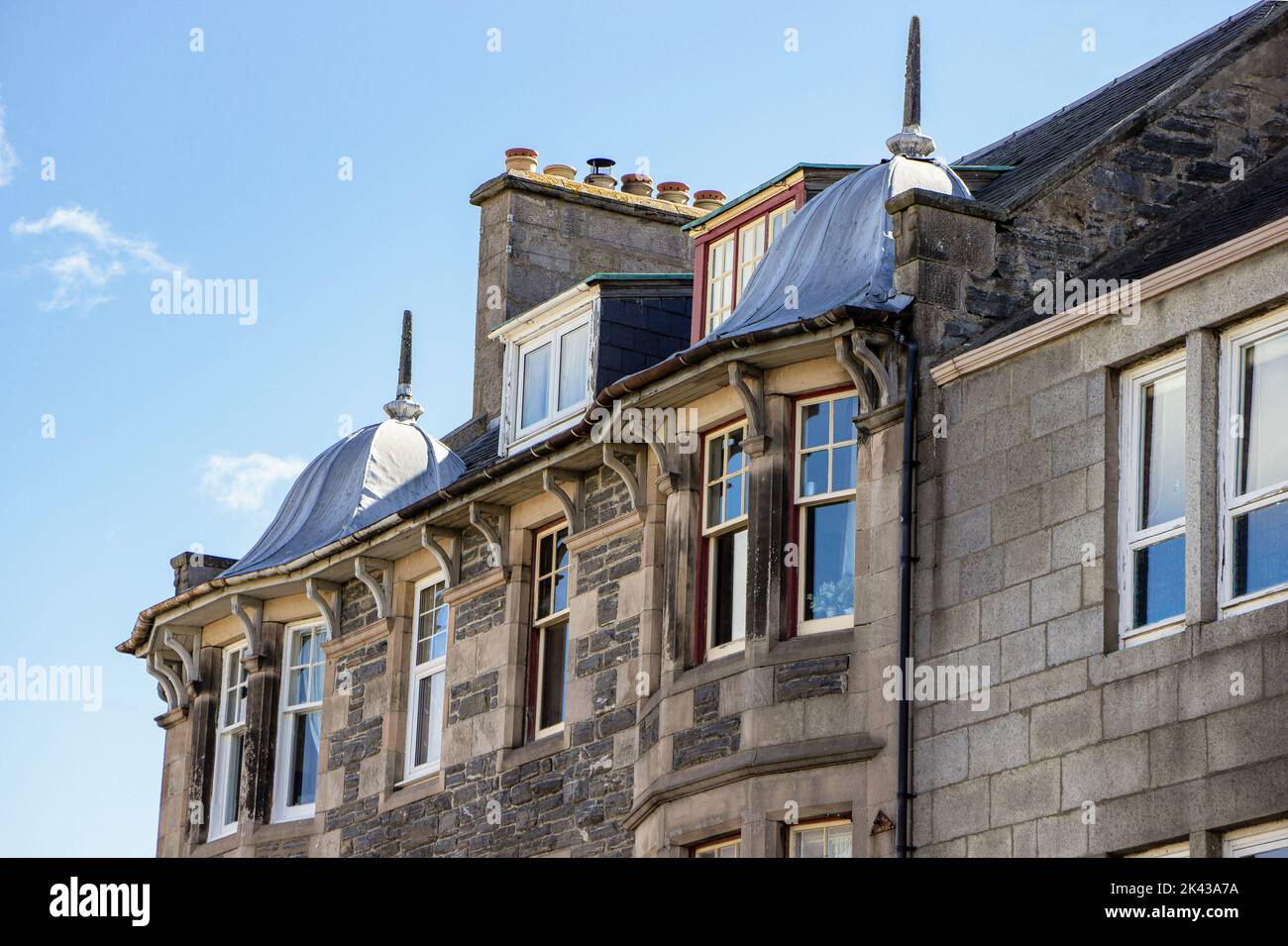 view of the top of a buildingwith a domed roof, roof windows and ...