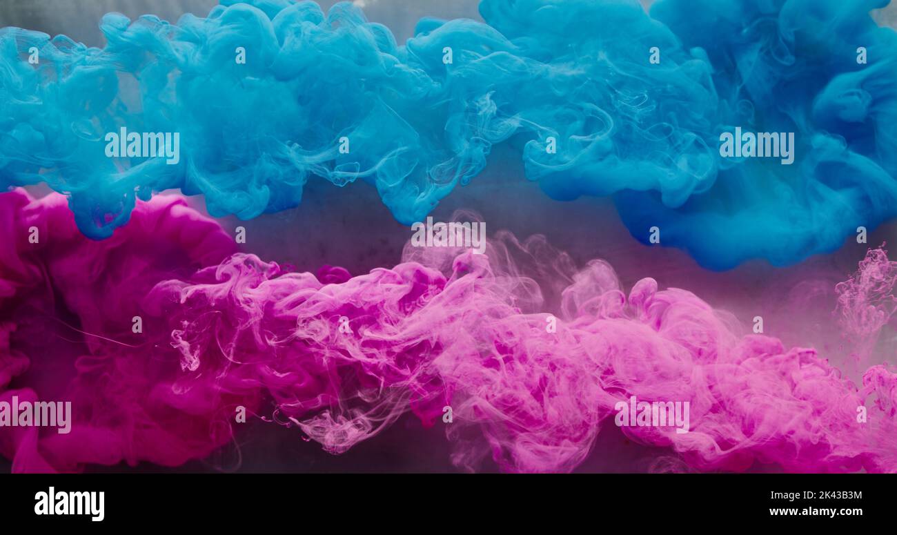 Ink water. Spreading paint clouds. Multicolor dye mixing. Art ...