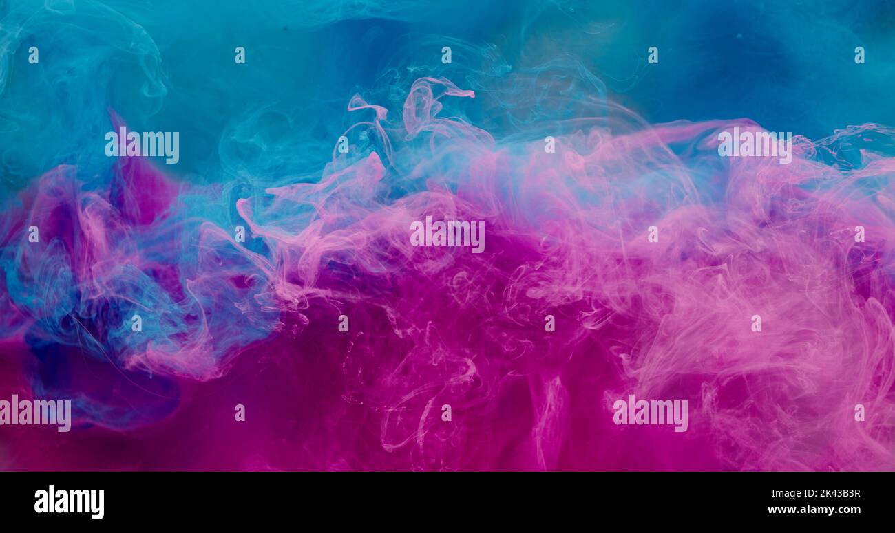 Ink water. Spreading paint clouds. Multicolor dye mixing. Art ...