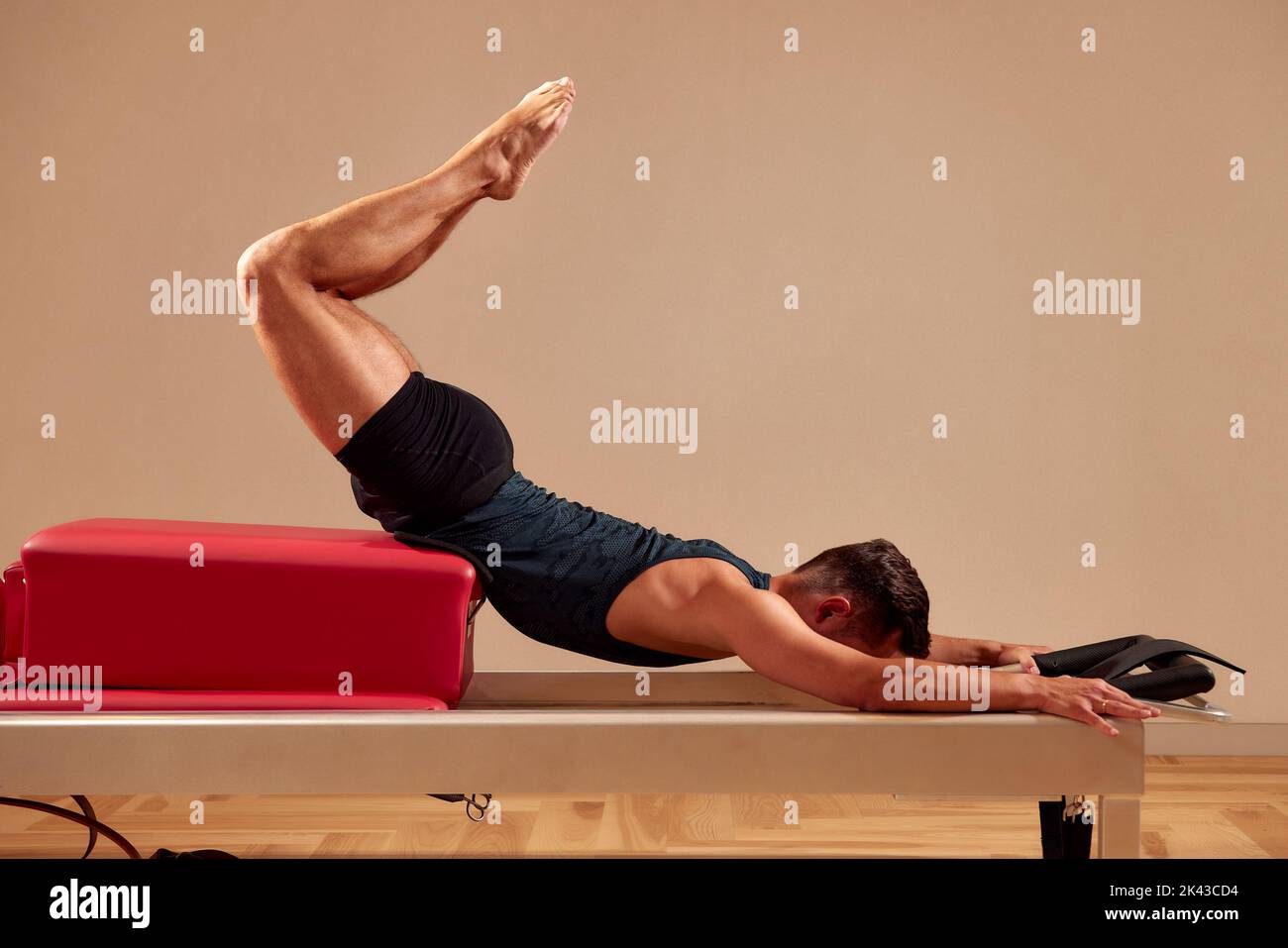 Pilates reformer workout exercises man at gym indoor Stock Photo - Alamy