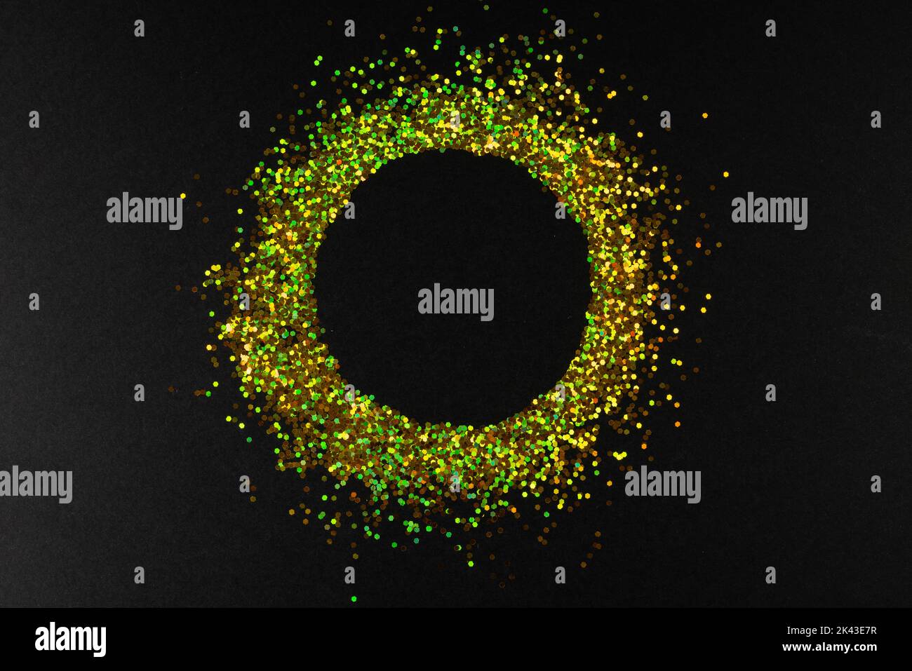 Composition of circle of gold spots on gray background Stock Photo - Alamy