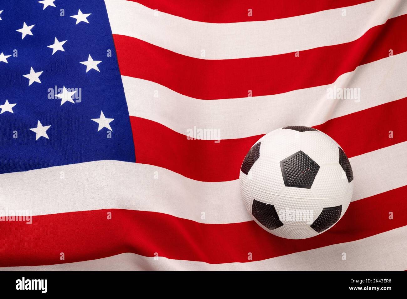 Composition of football over national flag of usa Stock Photo - Alamy