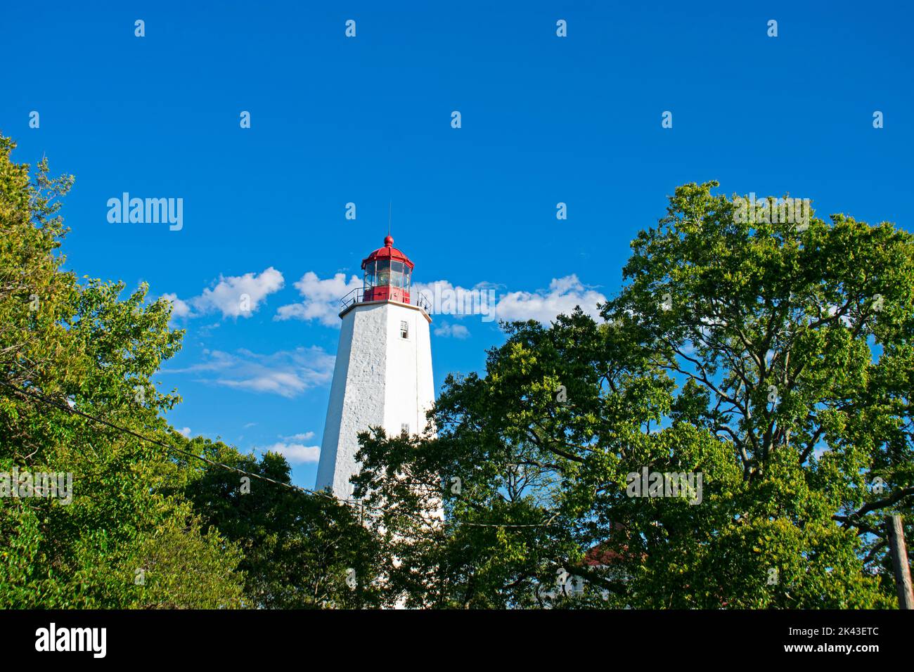 Lighthouse in Sandy Hook, New Jersey, with late afternoon shadows and a ...