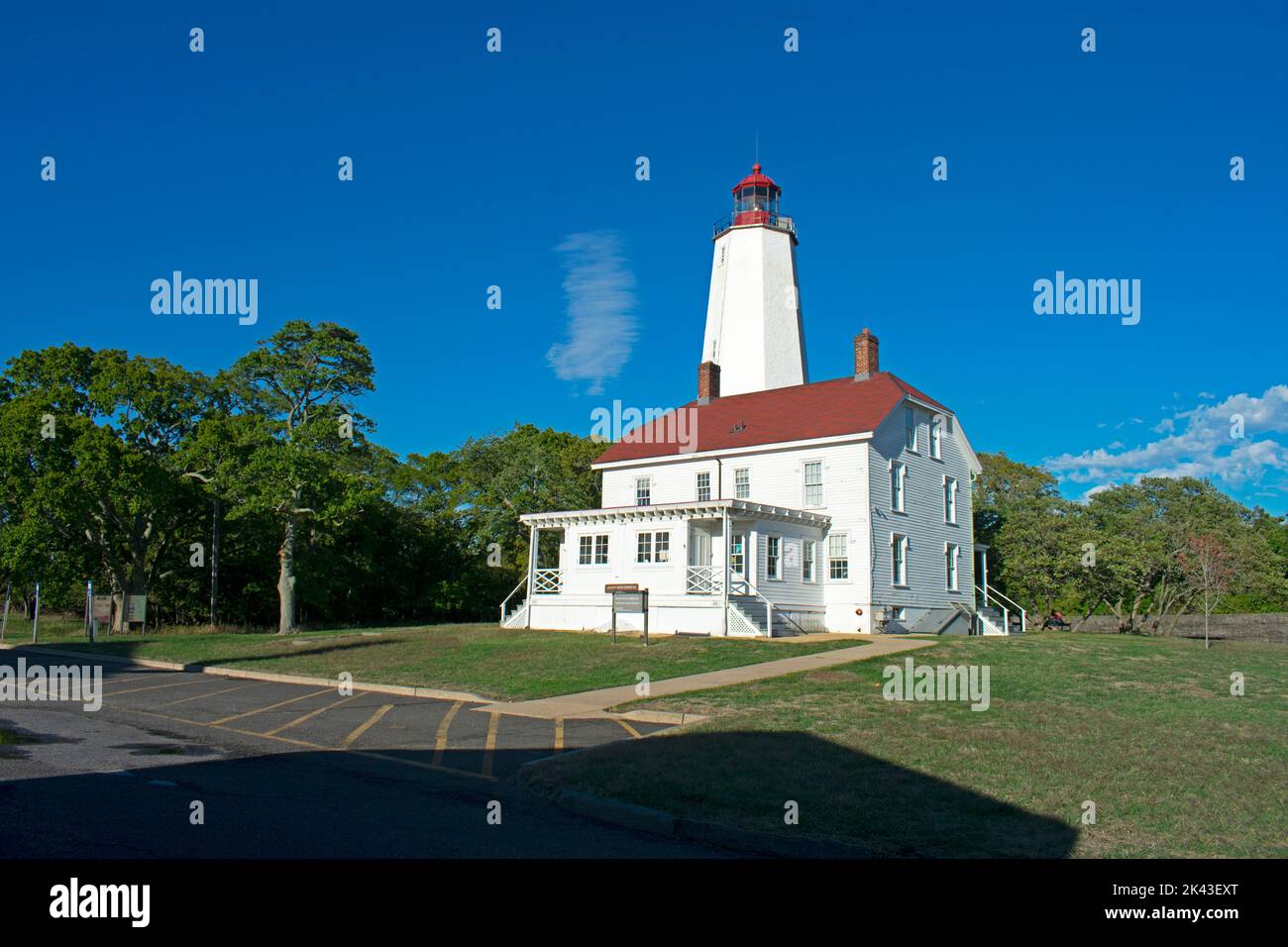 Lighthouse in Sandy Hook, New Jersey, with late afternoon shadows and a ...
