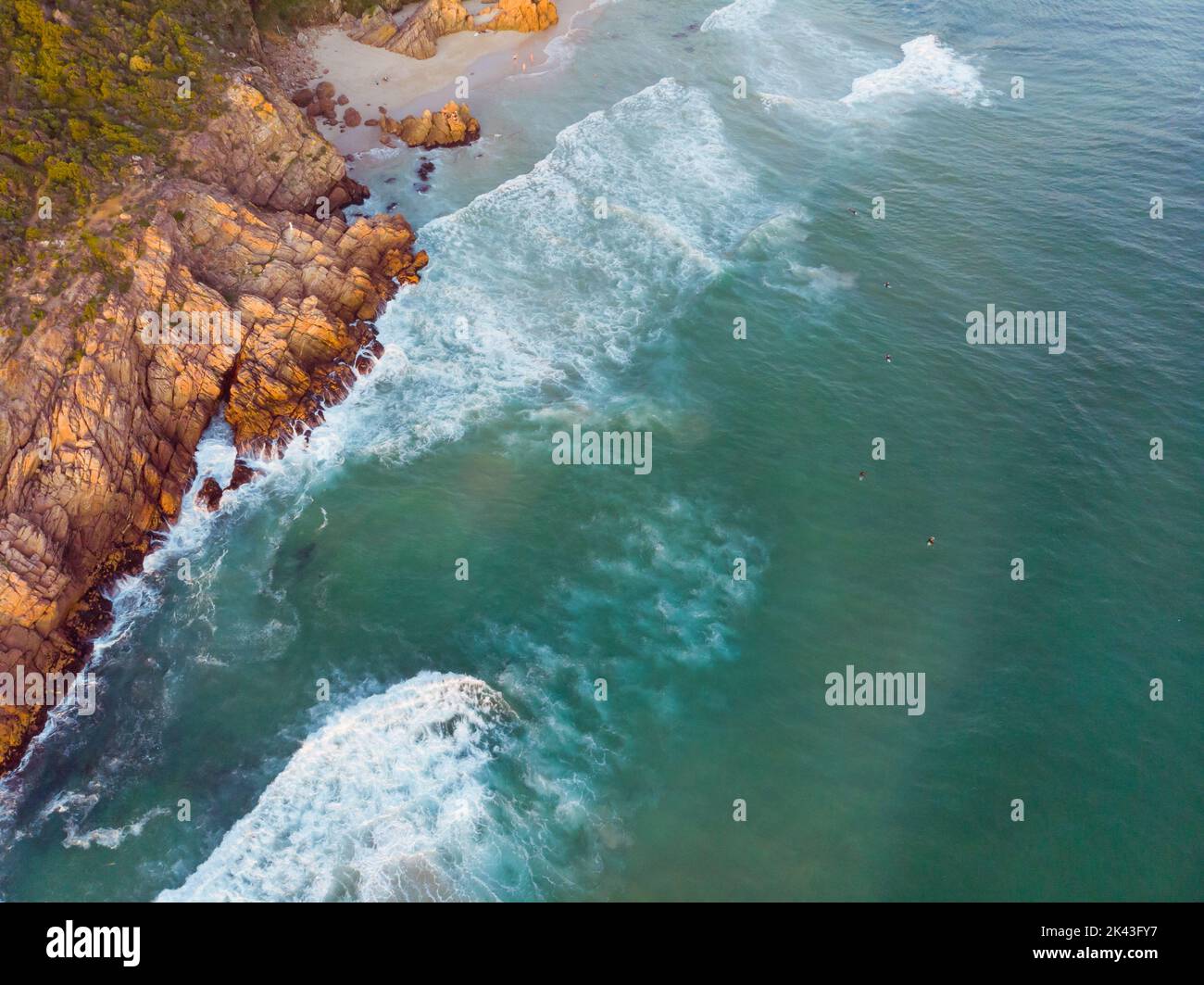 High angle view of sea waves and sea shore with rocky cliff shore Stock ...
