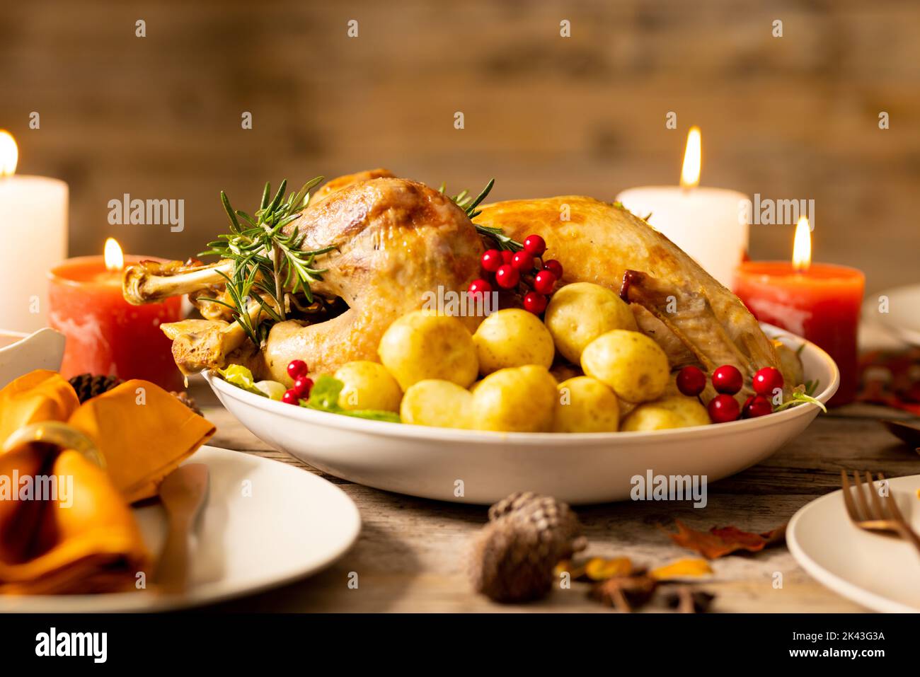 Overhead view of thanksgiving table with roast chicken, vegetables and ...