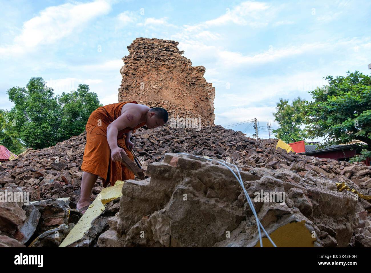 A monk inspects the Ancient Buddhist pagoda a 500-year-old Buddhist ...