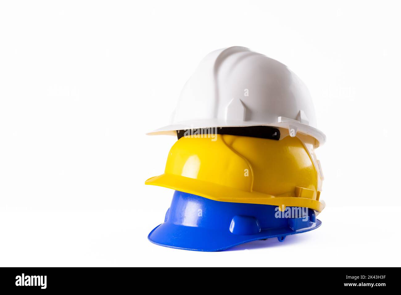Image of stack of helmets lying on white surface Stock Photo - Alamy
