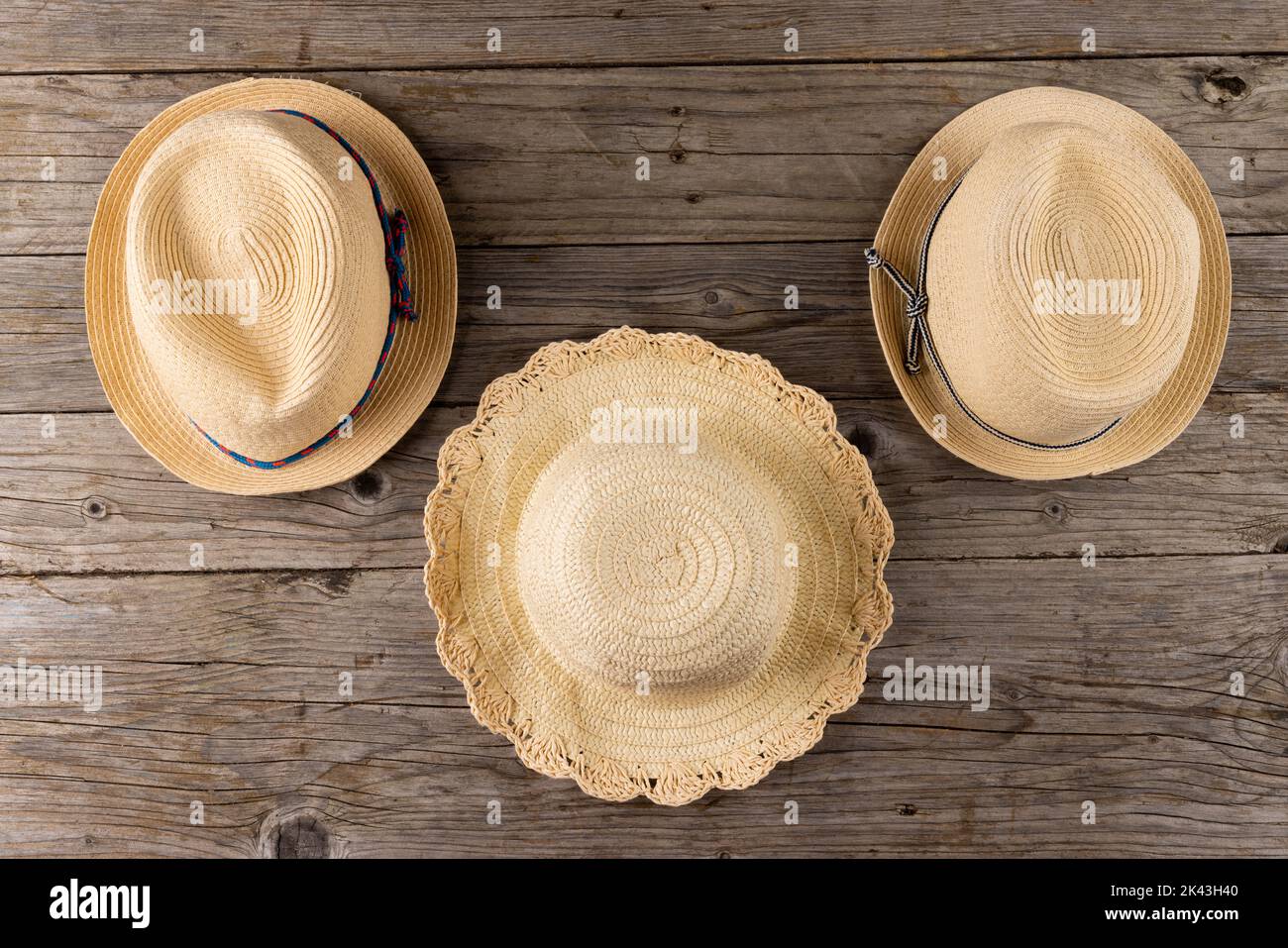 Image of straw hats lying on wooden surface Stock Photo - Alamy