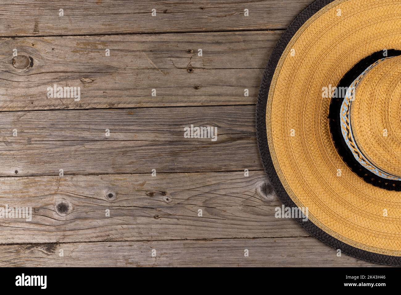 Image of straw hat lying on wooden surface Stock Photo - Alamy