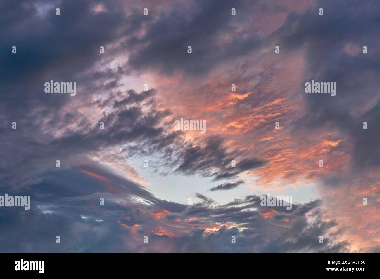 Evening sky in the picturesque clouds, lit by the rays of the setting ...