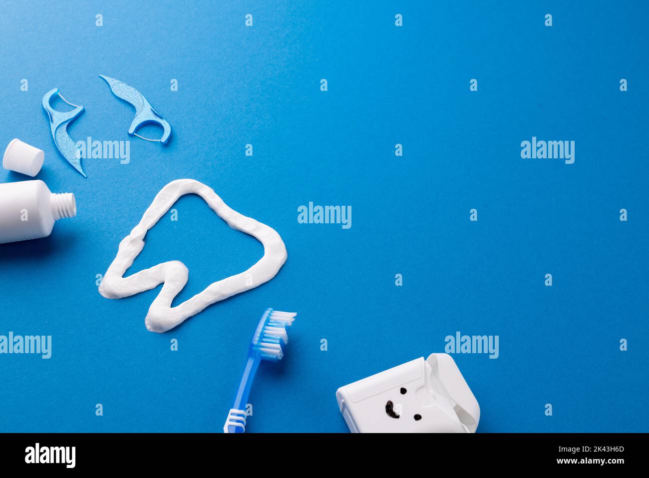 Image of toothbrush, toothpaste, string, liquid and tooth made of paste ...