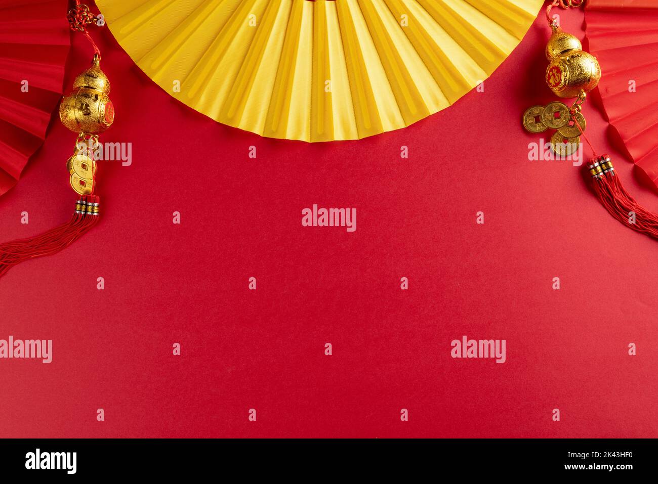 Composition of traditional chinese fans and decorations on red ...