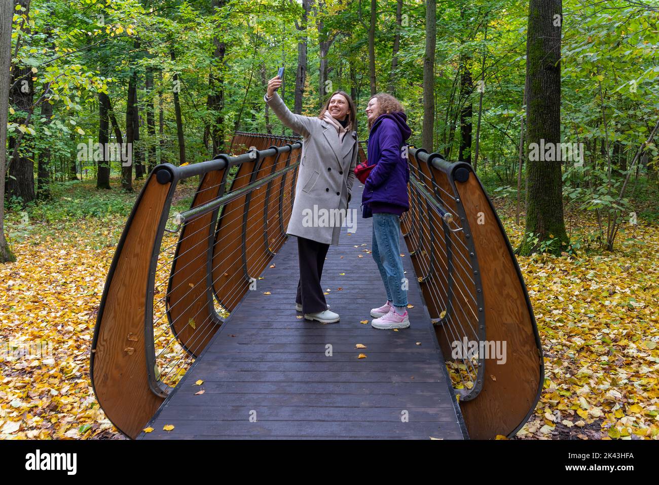 Moscow. Girls are photographed on an air eco-trail in the Landscape ...