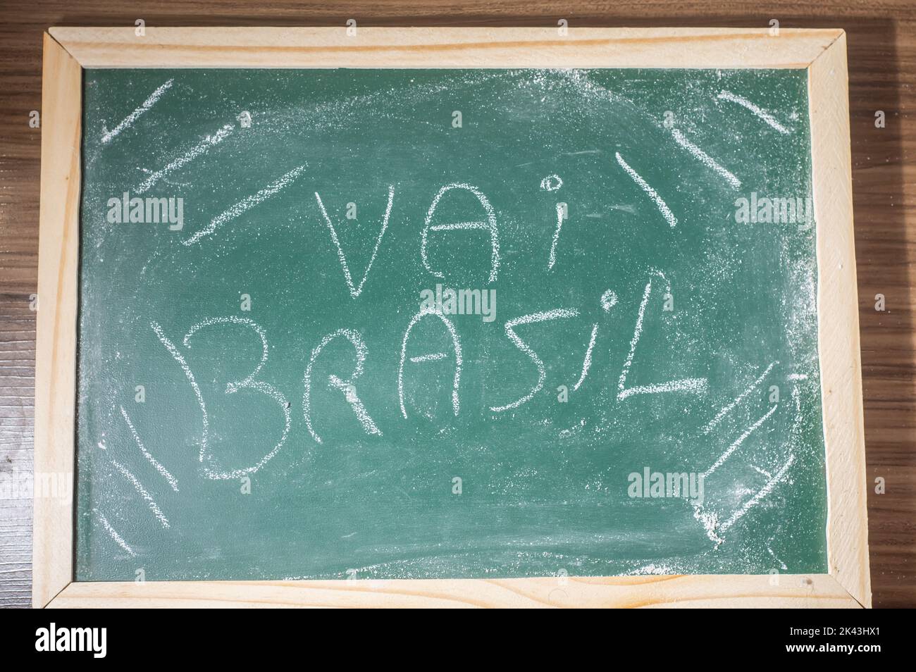 Green chalkboard with the phrase "goes brazil" written in Portuguese ...
