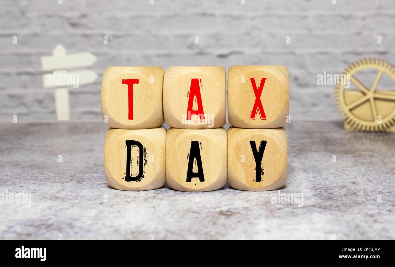 Tax Day Word alphabet letter And Alarm Clock on blue background Stock ...