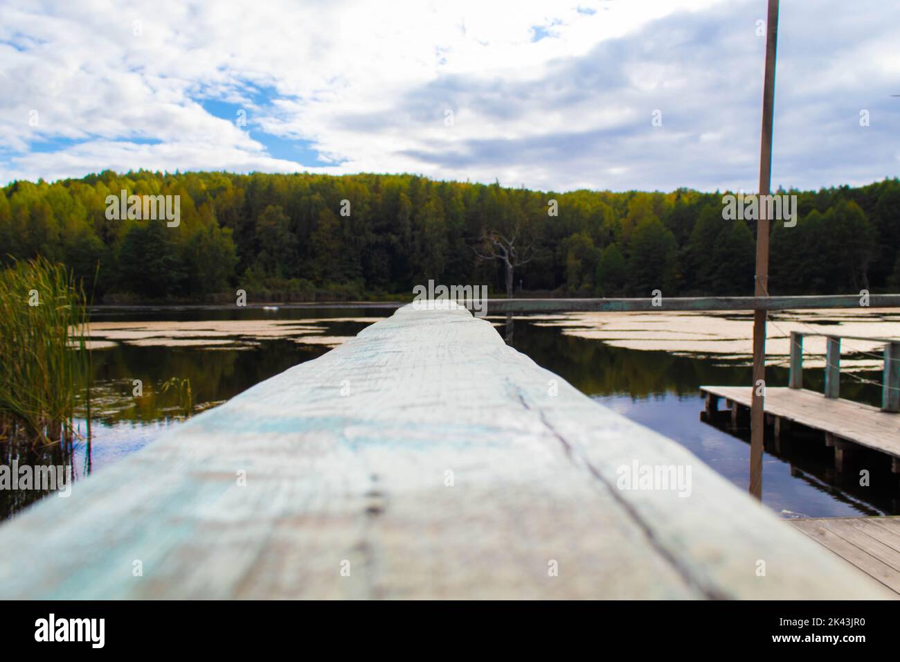 blue sky clear with perspective wooden bridge extending into the sea at ...