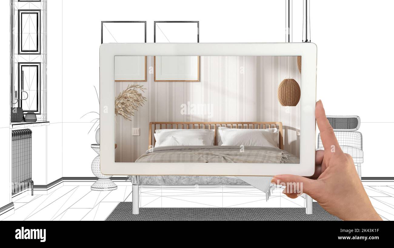 Augmented reality concept. Hand holding tablet with AR application used ...