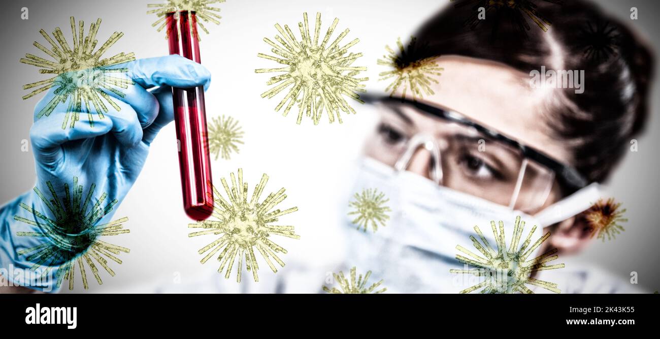 Female scientist looking at test tube against digital image of blue ...