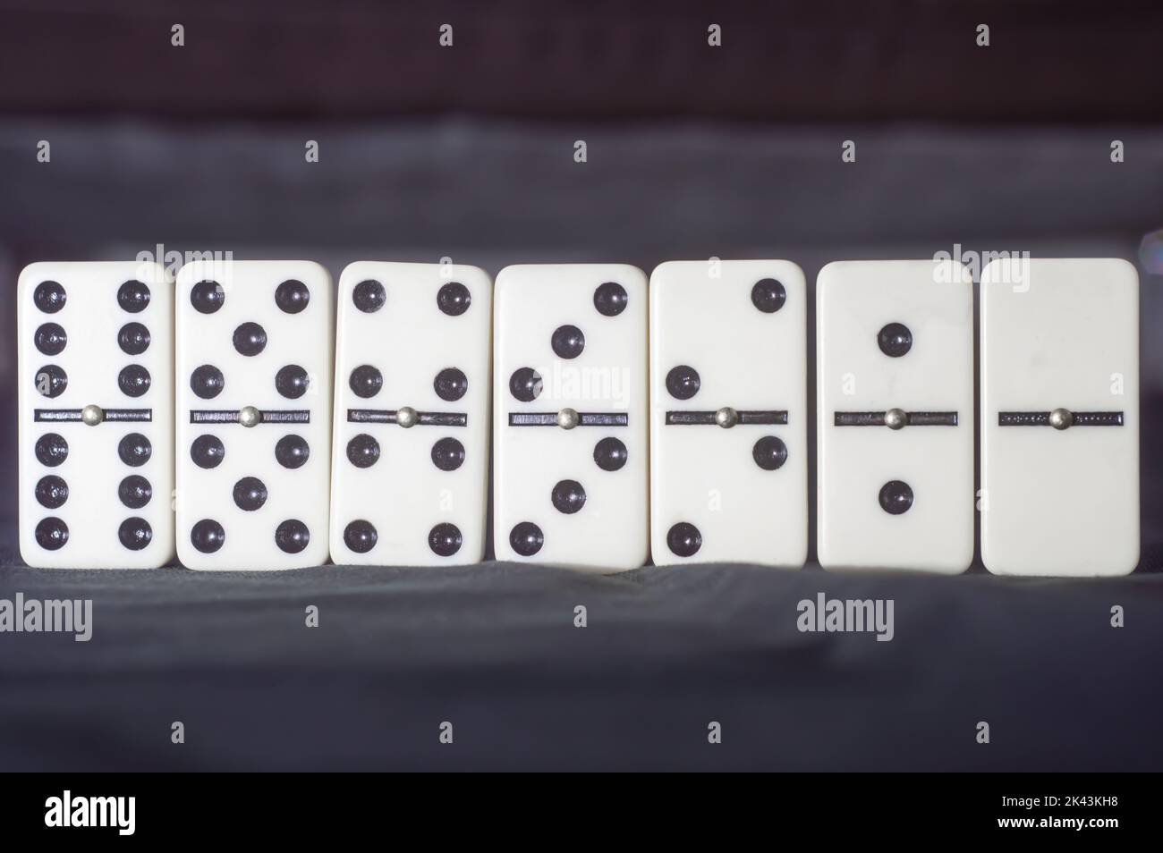 Domino pieces together from number 6 to 0 standing and highlighted ...