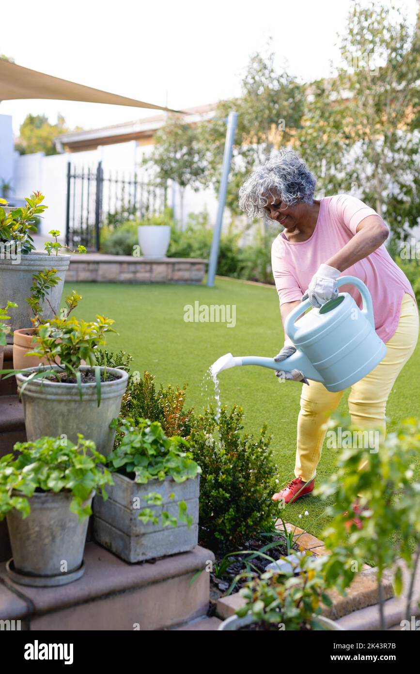 African women watering plants hi-res stock photography and images - Alamy